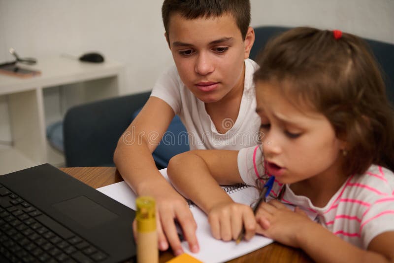 Siblings Learning Together with a Laptop at Home Stock Image - Image of ...