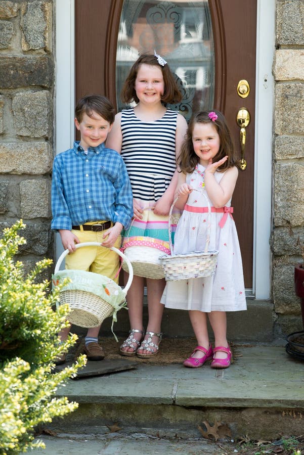 Young Siblings Outside Dressed Up for Easter Holding Baskets Stock ...