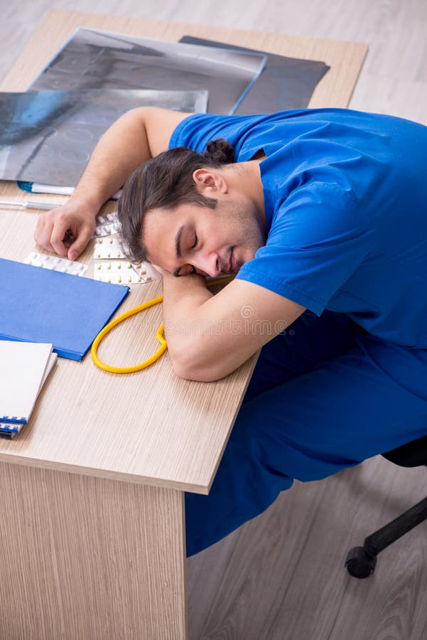 Young Male Sick Doctor Being Unhappy after Night Shift Stock Image ...