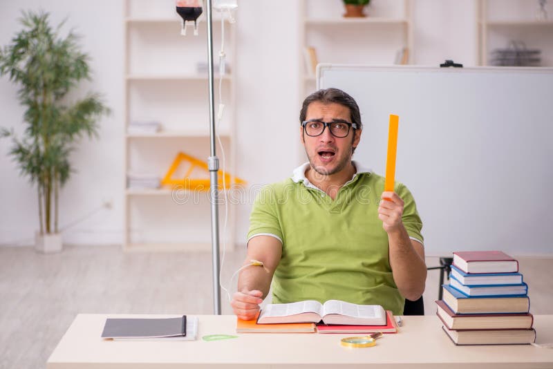 Young Sick Male Teacher Student in Blood Transfusion Concept Stock ...