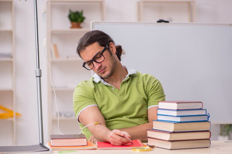 Young Sick Male Teacher Student in Blood Transfusion Concept Stock ...