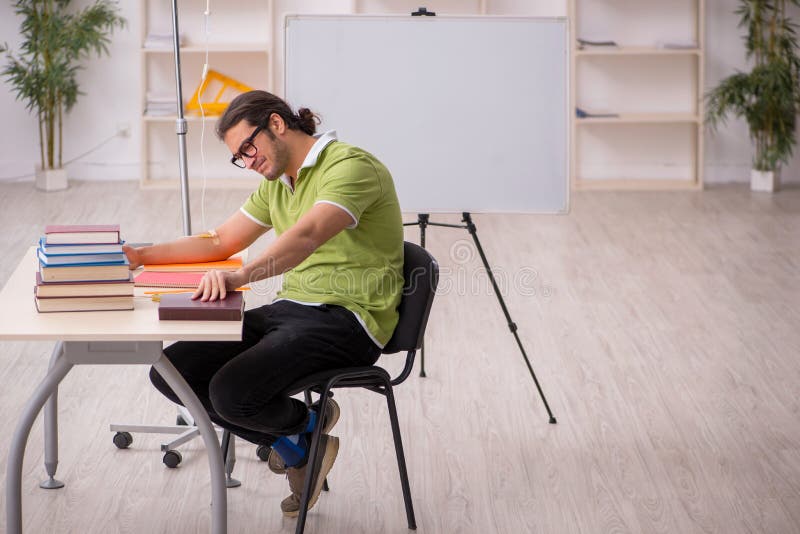 Young Sick Male Teacher Student in Blood Transfusion Concept Stock ...