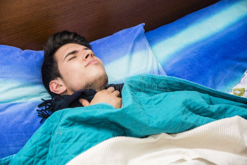 Young Sick or Unwell Man in Bed Stock Photo - Image of cold, medicine ...