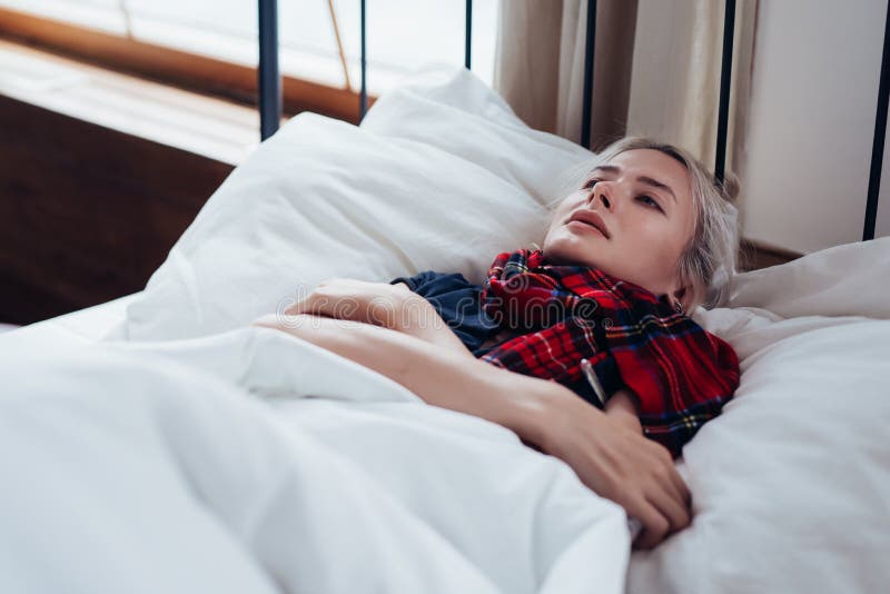 A Young Sick Woman in Bed with Chills Stock Photo - Image of simulate ...
