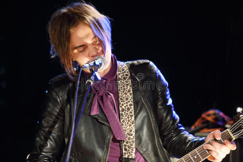 Young Singer in Leather Jacket with Closed Eyes Plays Guitar Stock ...