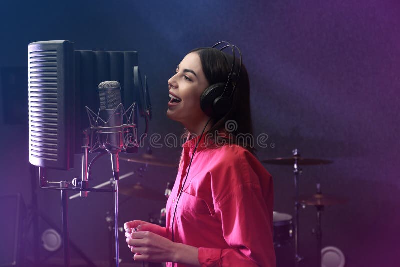 Young Singer with Microphone Recording Song Stock Photo - Image of ...