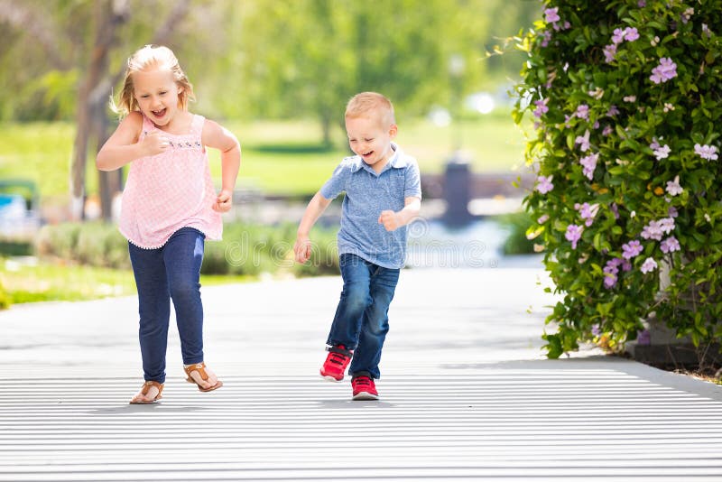 Young Sister and Brother Having Fun Running at the Park Stock Image ...