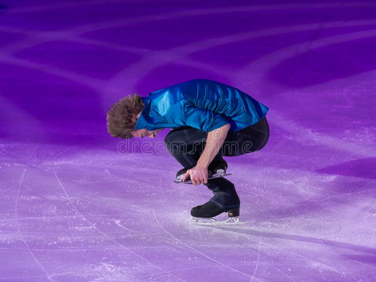 Young Skater Performing a Spin on the Ice Rink Editorial Image - Image ...