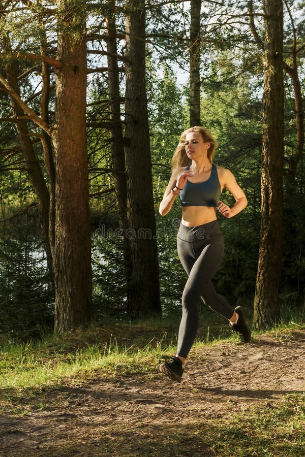 Young Slim Athletic Woman Getting Ready for Marathon while Running ...