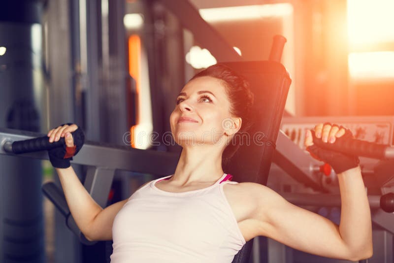 Young Slim Woman Doing Chest Fly Exercise in Gym Stock Photo - Image of ...