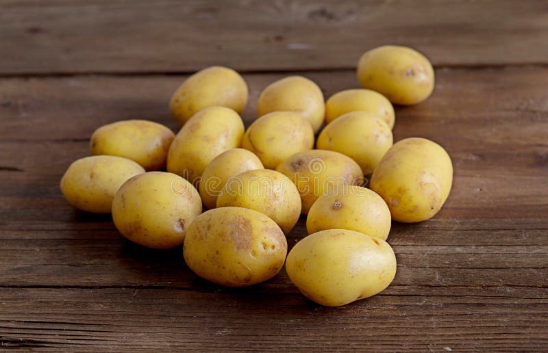 Potatos on wooden board stock image. Image of wooden - 117451633