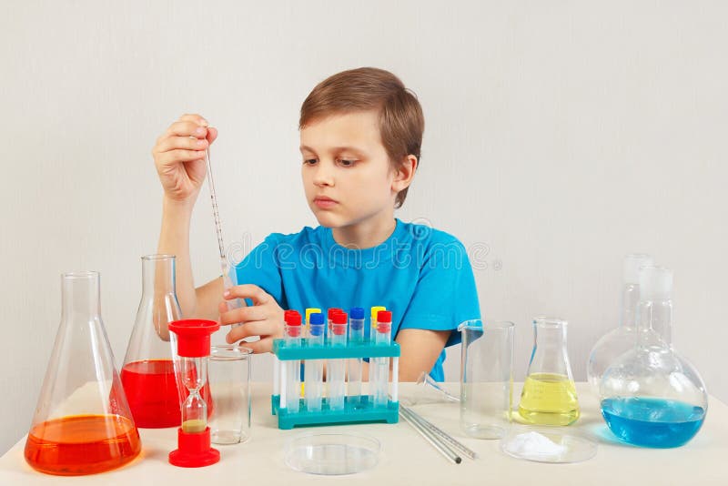 Young Smart Boy Doing Chemical Experiments in Laboratory Stock Image ...