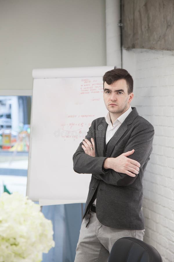 Businessman Works in an Office and Stands Thoughtfully Stock Photo ...