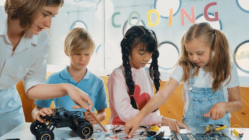 Young Smart Teacher Teaching Diverse Students about Electronic Board ...