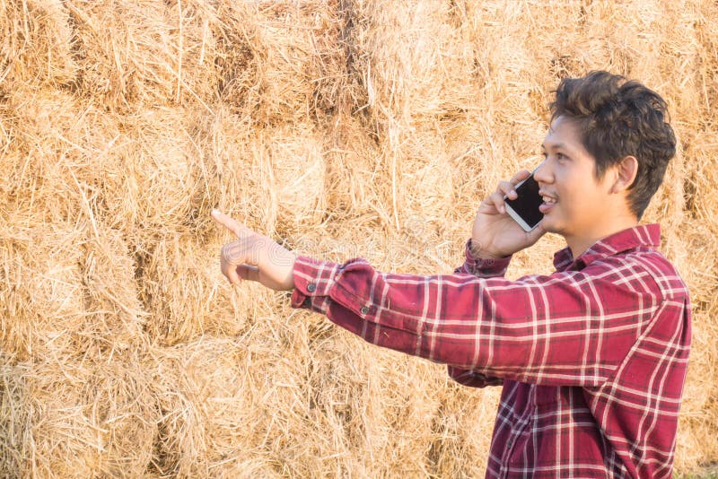 Thai Farmer Using Smartphone in a Farm Stock Image - Image of mobile ... Thai Farmer Using Smartphone in a Farm Stock Image - Image of mobile ...
