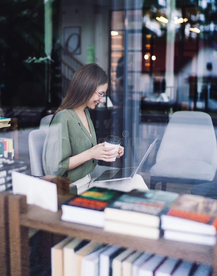 Young Smart Lady Using Laptop in Bookstore Stock Image - Image of ...