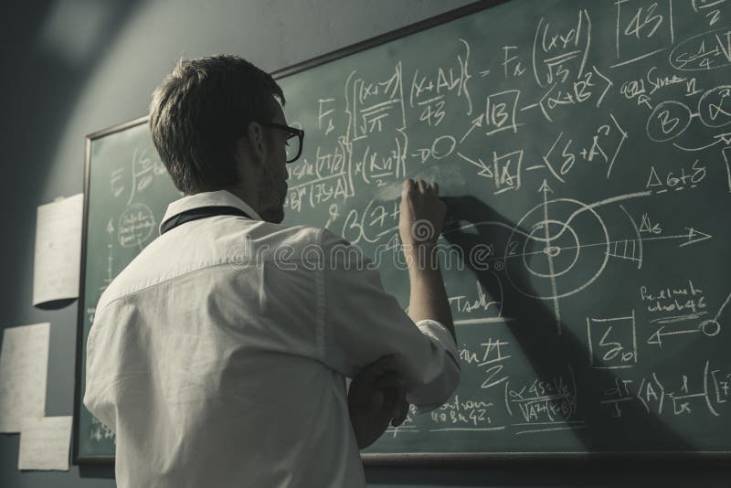 Mathematician Solving Problems and Writing Formulas on the Chalkboard ...