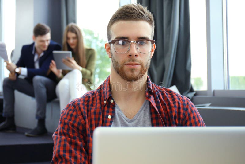 Young Smart People are Using Gadgets while Working Hard in the Modern ...