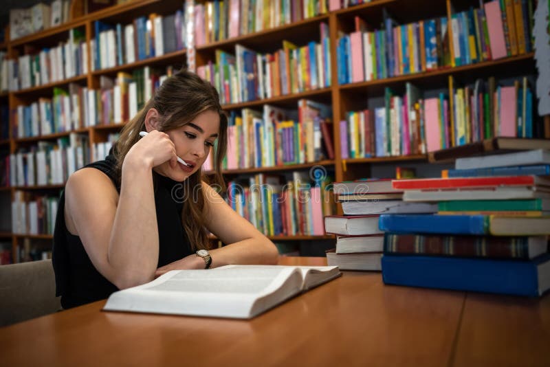 A Young Smart Student is Studying Useful and Interesting in a Beautiful ...