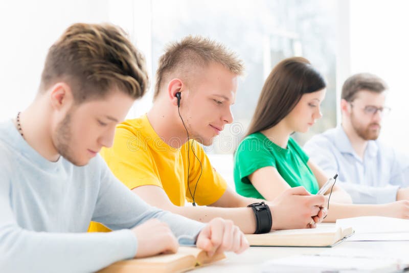 Young and Smart Students Learning in a Classroom Stock Image - Image of ...