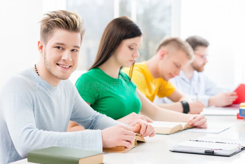 Young and Smart Students Learning in a Classroom Stock Image - Image of ...