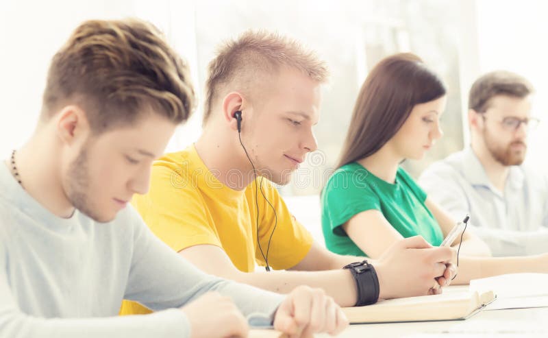 Young and Smart Students Learning in a Classroom Stock Image - Image of ...