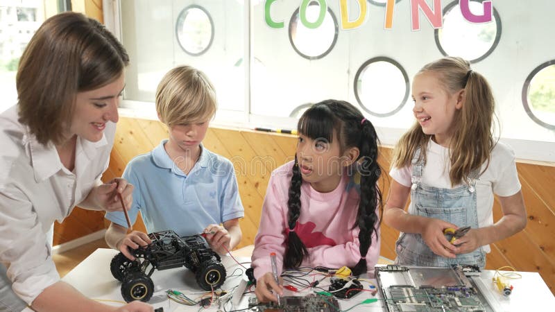 Young Smart Teacher Teaching Diverse Students about Electronic Board ...