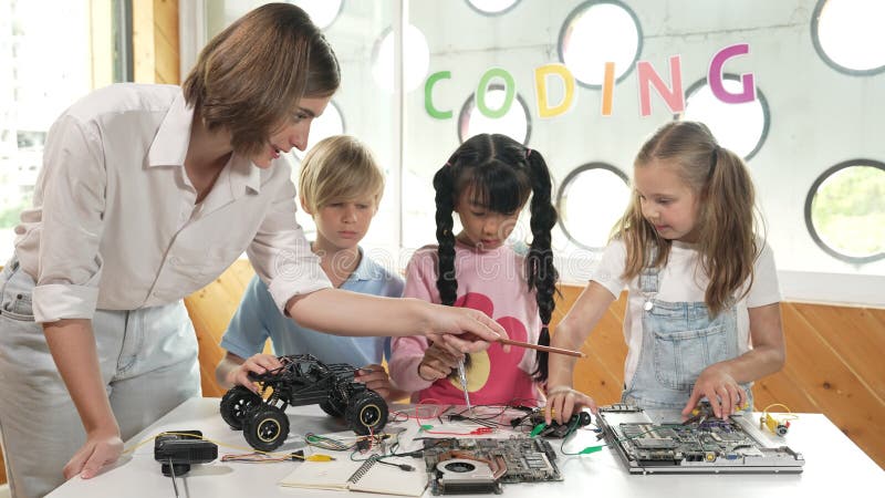 Young Smart Teacher Teaching Diverse Students about Electronic Board ...