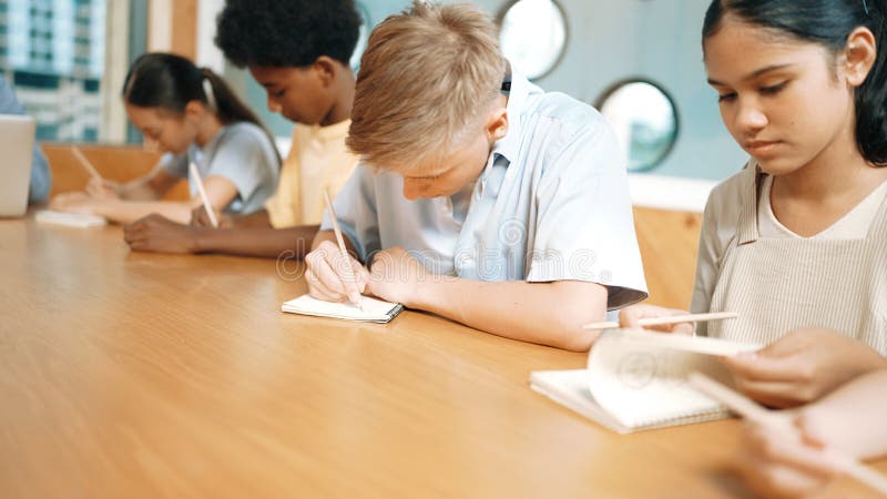 Young Smart Teenager Writing and Talking about Topic at Classroom ...