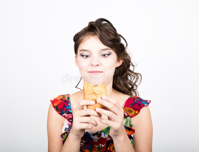 Young Smile Girl Holding and Biting Bread Roll Stock Photo - Image of ...