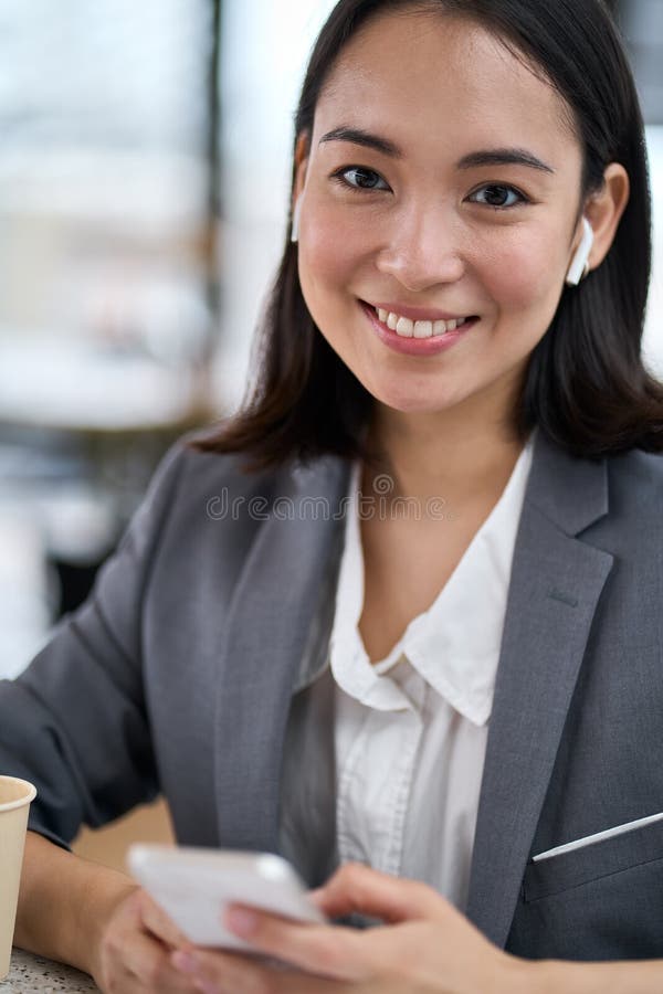 Young Smiling Asian Business Woman Wearing Suit Using Phone. Portrait ... Young Smiling Asian Business Woman Wearing Suit Using Phone. Portrait ...