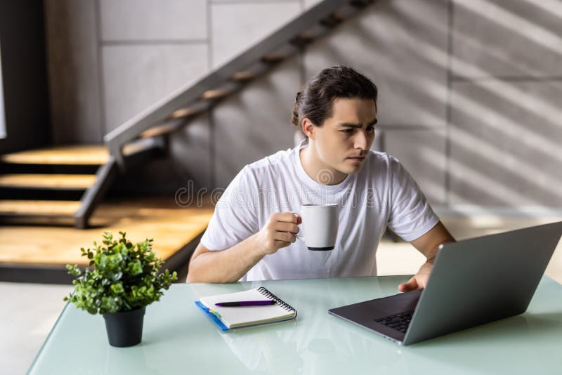 Young Smiling Attractive Freelancer Sitting in His Home Office and ...