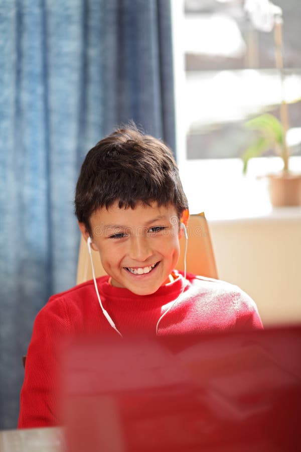 Young Smiling Boy Looking at a Computer Stock Photo - Image of line ...