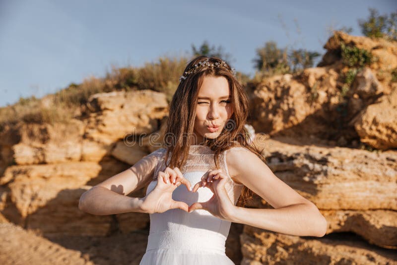 Young Smiling Bride Showing Heart Gesture with Hands Stock Image ...