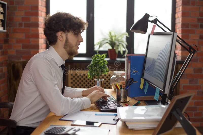 Young Smiling Business Man Working on Computer Stock Image - Image of ...