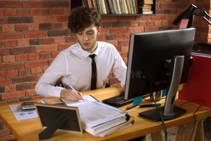 Young Smiling Business Man Working on Computer Stock Photo - Image of ...