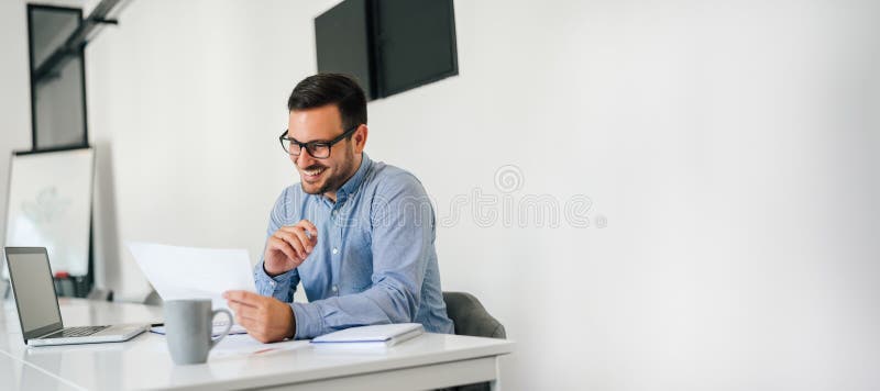 Young Smiling Cheerful Confident Businessman Checking Working Plan and ...