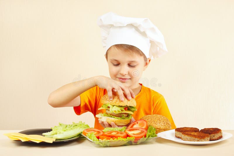 Young Smiling Chef Shows How To Cook Hamburger Stock Image - Image of ...
