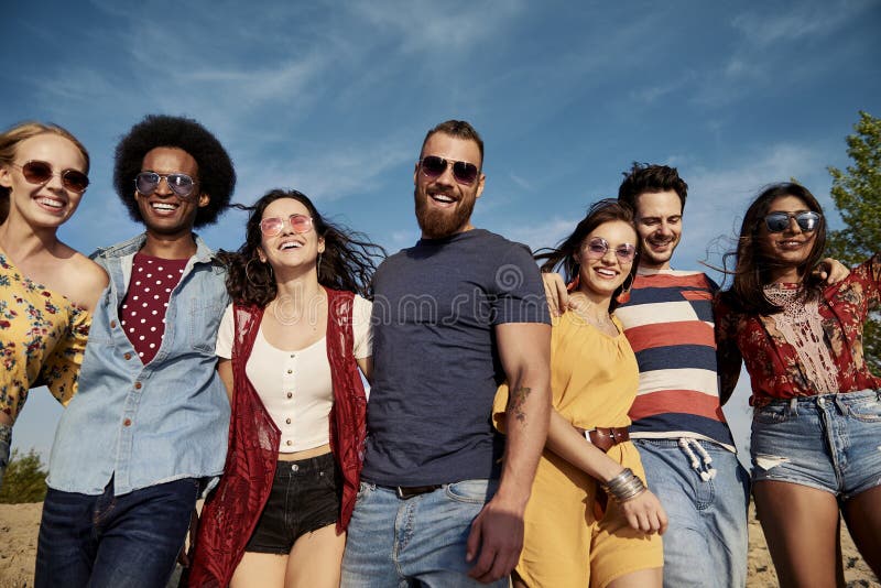 Young Smiling People in a Row on the Fresh Air Stock Photo - Image of ...