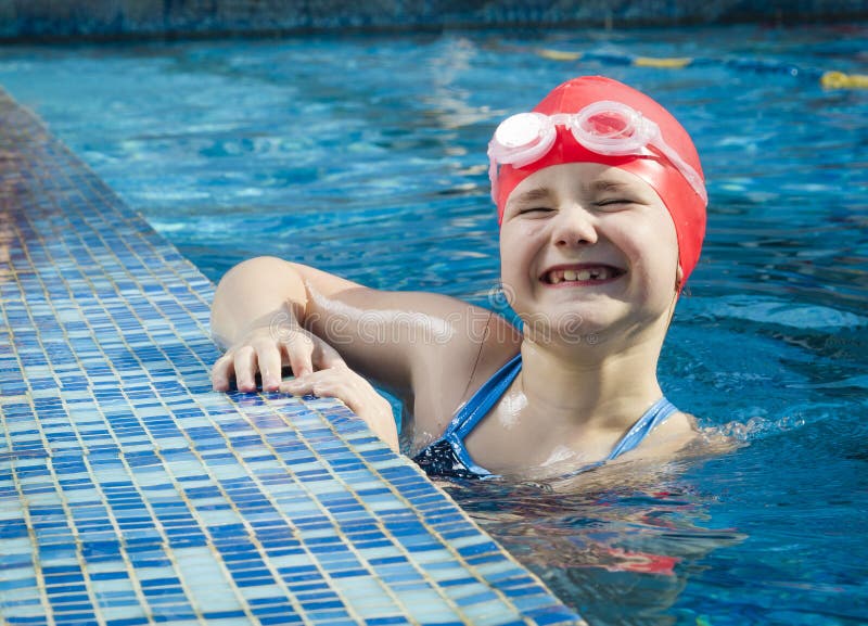 Young Smiling Girl Learning To Swim in the Pool Stock Image - Image of ...