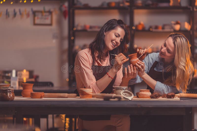 Young Smiling Girls at Work Indoors Stock Image - Image of pottery ...