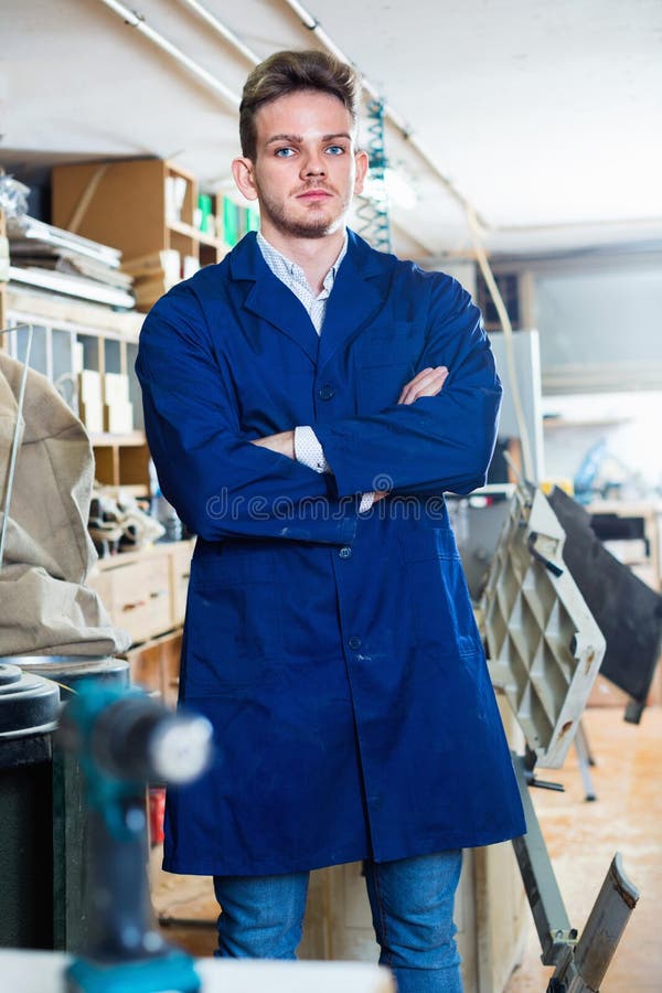 Guy Displaying His Workplace and Tools at Workshop Stock Image - Image ...