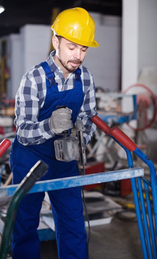 Guy Using Angle Grinder for Construction at Workplace Stock Image ...