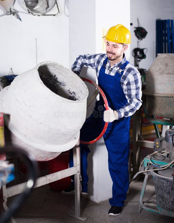 Young Smiling Guy Using Concrete Mixer at Workshop Stock Image - Image ...