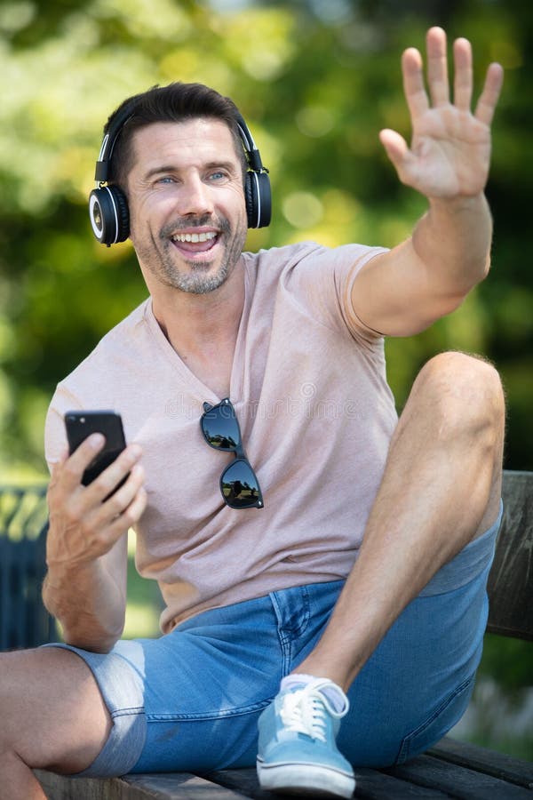 Young Smiling Guy Waving Someone Stock Image - Image of looking, dating ...