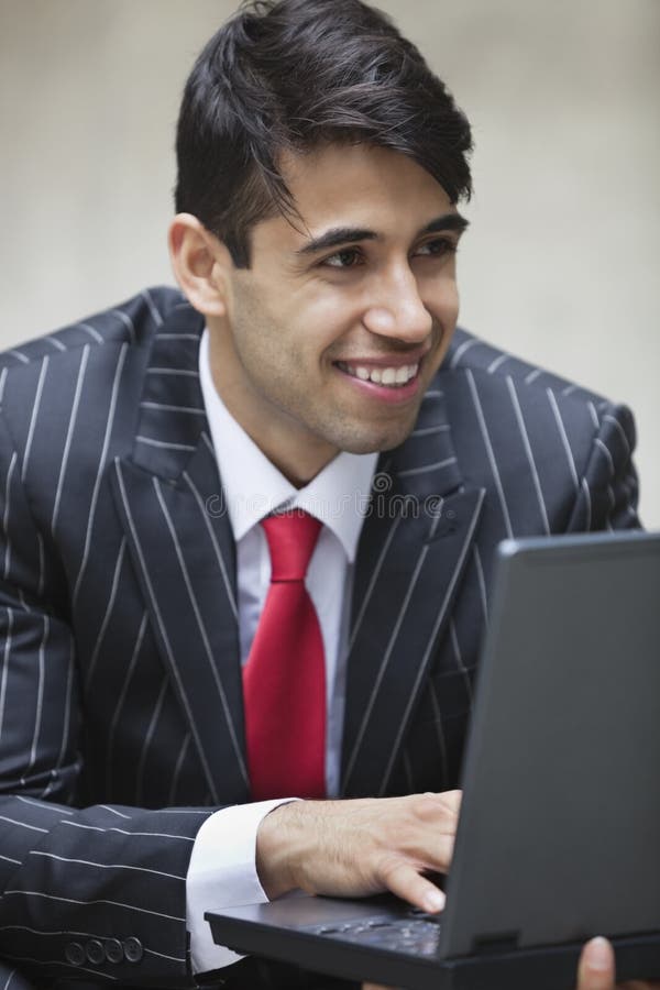 Young Smiling Indian Businessman Using Laptop Stock Photo - Image of ...