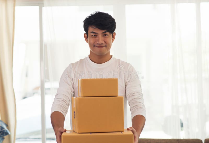 Young Logistic Delivery Man Holding the Box Stock Photo - Image of ...