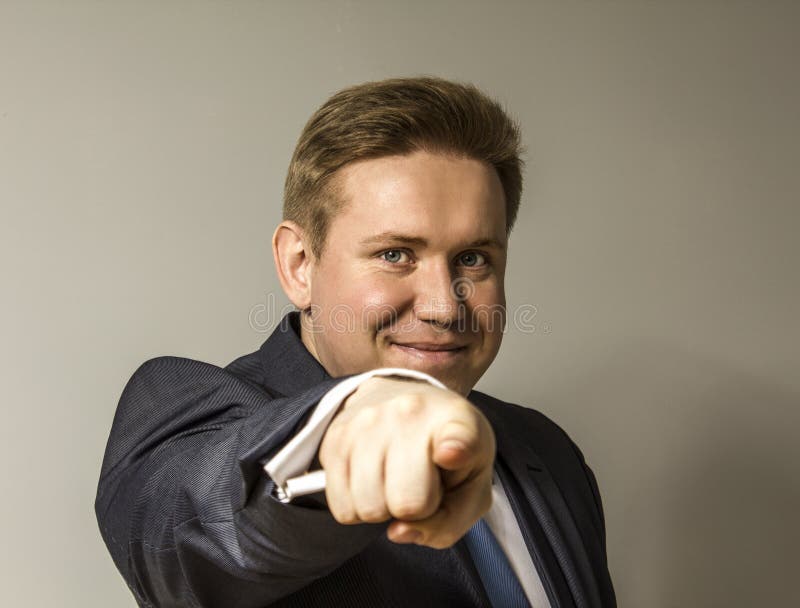 Young Smiling Man Pointing with a Finger Stock Image - Image of ...