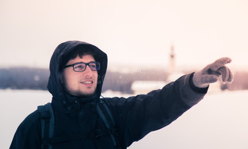 Young Smiling Man is Pointing Somewhere, Outside, Wintertime Stock ...