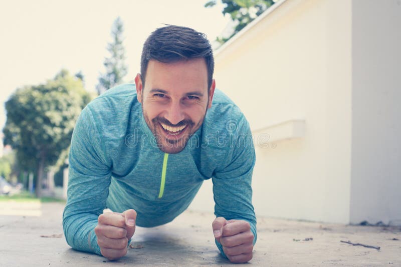 Young Smiling Man Working Plank on Sidewalk. Stock Image - Image of ...